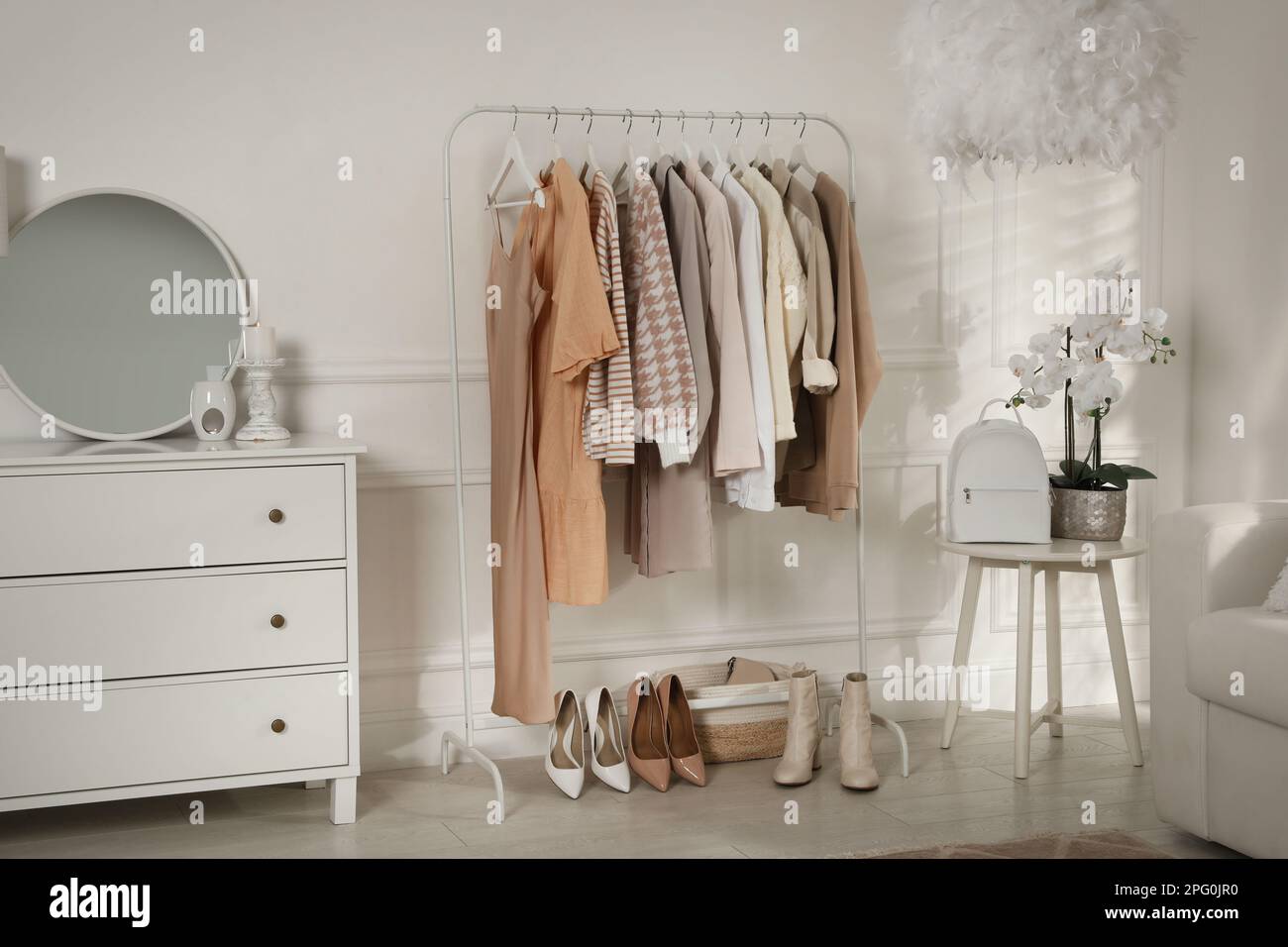 Modern dressing room interior with stylish clothes, shoes and beautiful ...