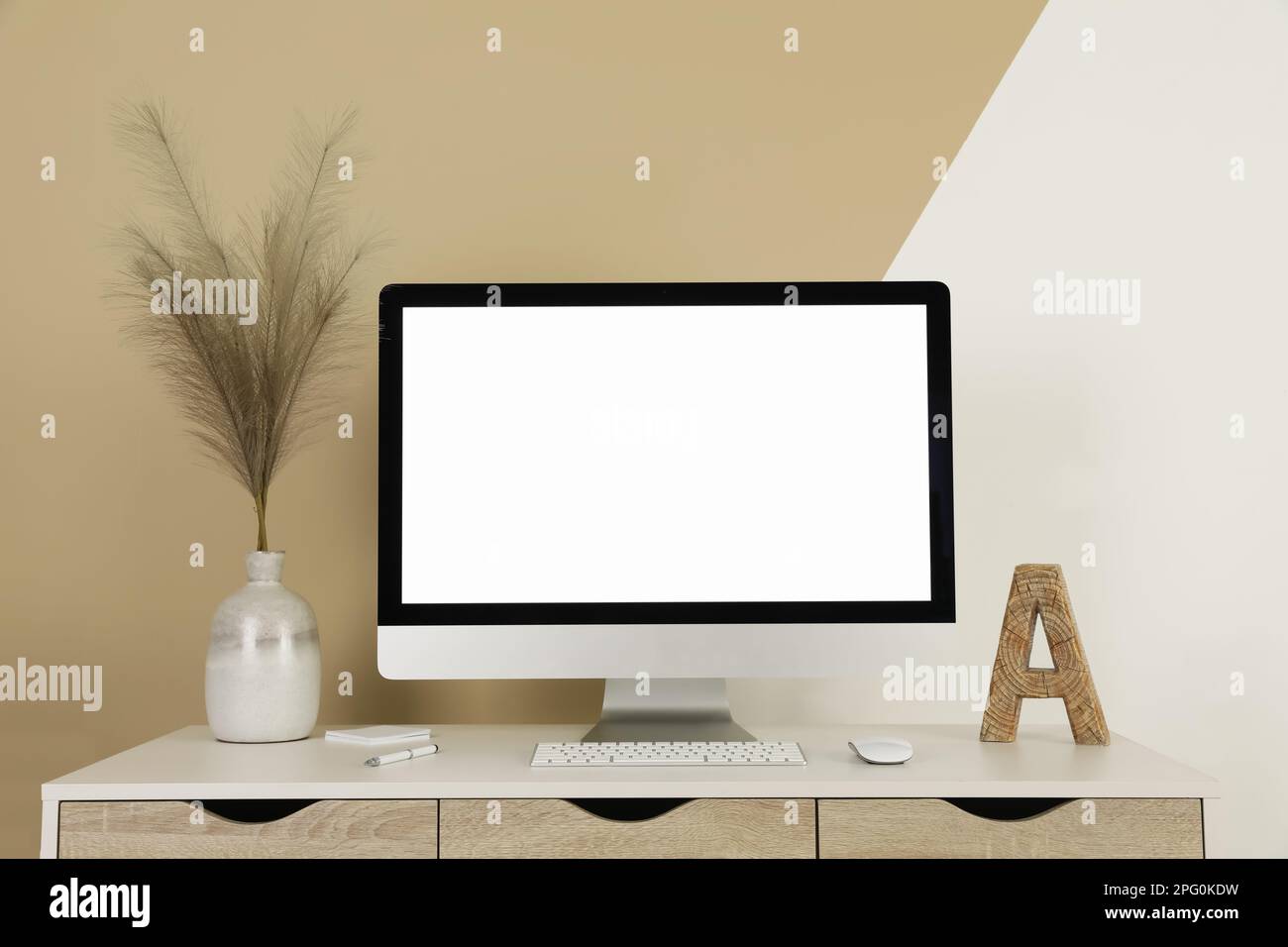 Modern computer, decor and office supplies on white wooden table near ...