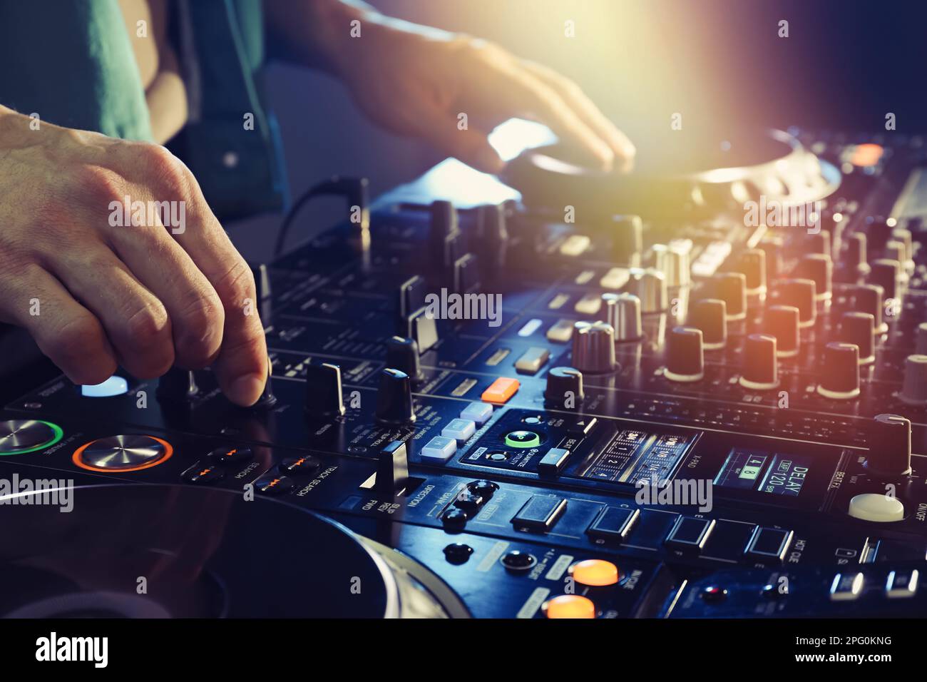 DJ creating music on modern console mixer in night club, closeup Stock ...