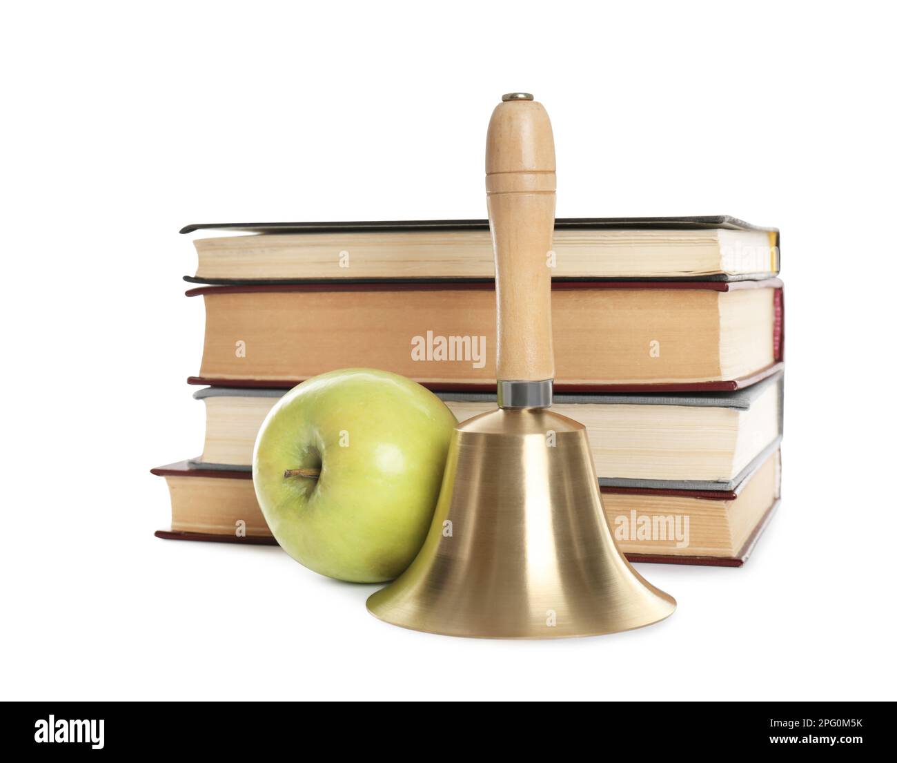 Golden school bell with wooden handle, apple and stack of books on ...