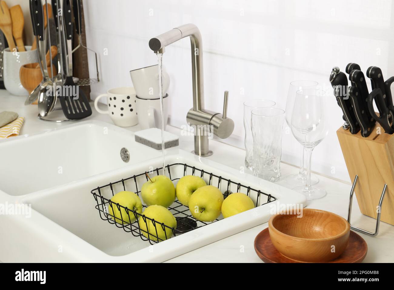 Kitchen counter with sink and cooking utensils Stock Photo - Alamy