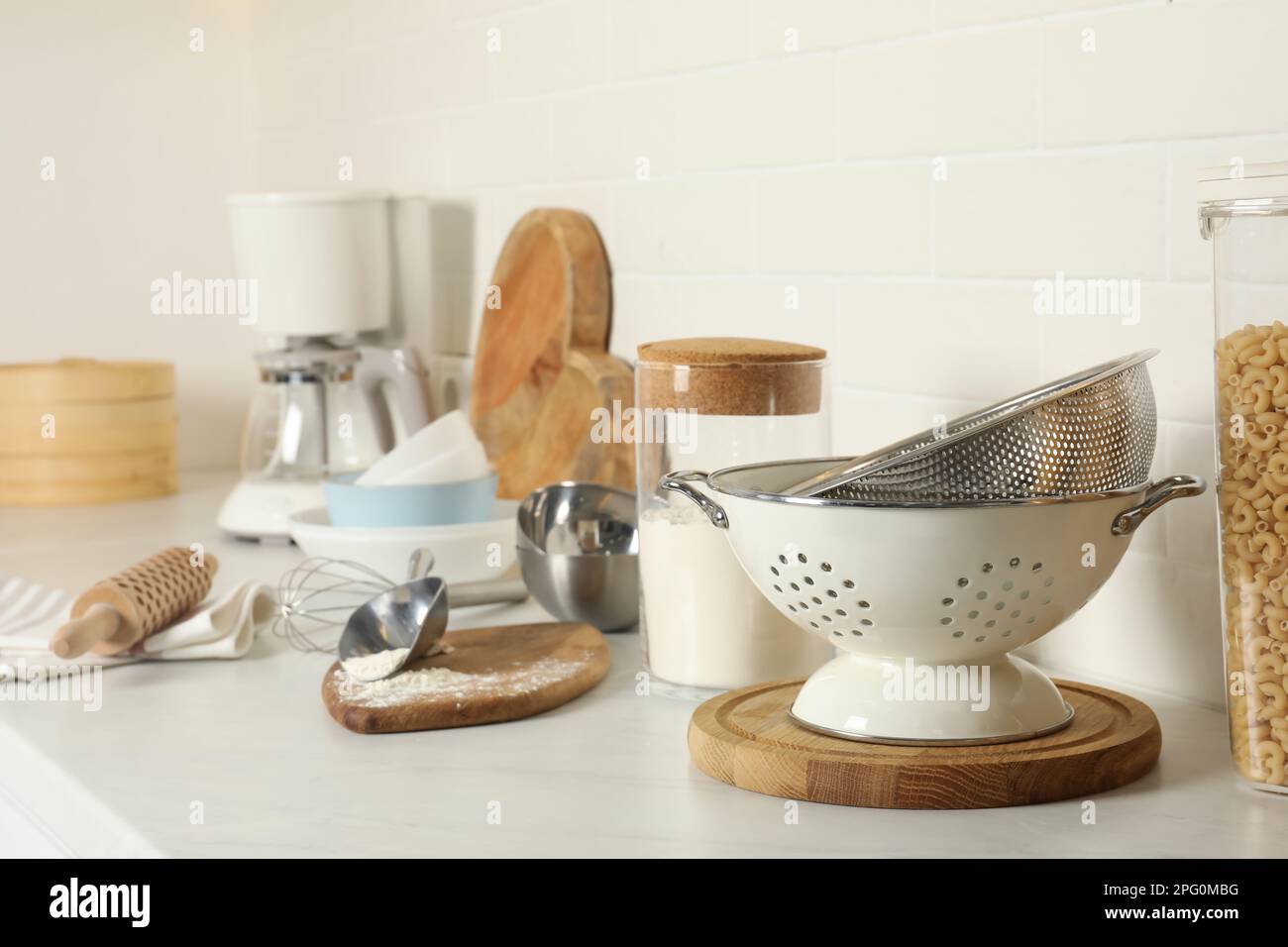 Cooking utensils and products on kitchen counter Stock Photo - Alamy