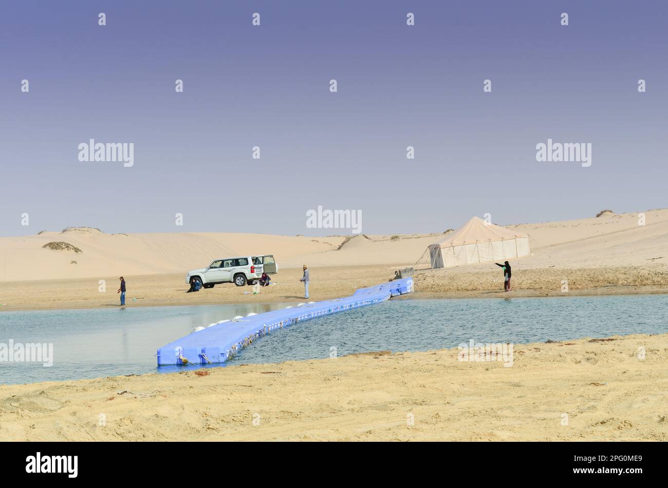 Sand dunes descending into the creek at Al-Adaid Desert in Qatar Stock ...