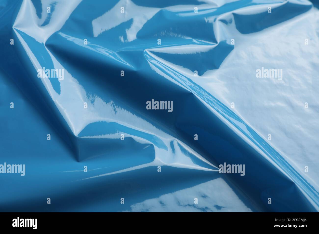 Closeup view of light blue plastic stretch wrap film as background ...