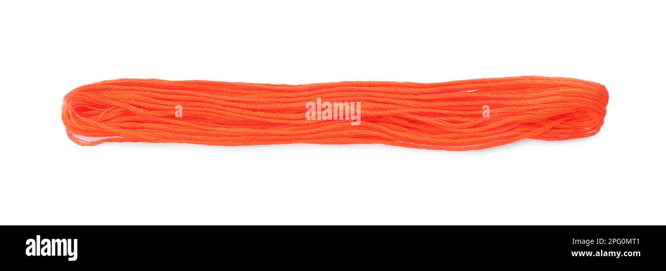 Bright coral embroidery thread on white background Stock Photo - Alamy