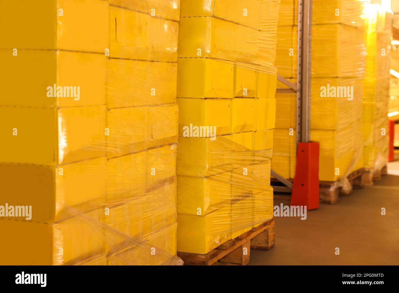 Warehouse with stacks of boxes on wooden pallets. Wholesaling Stock ...