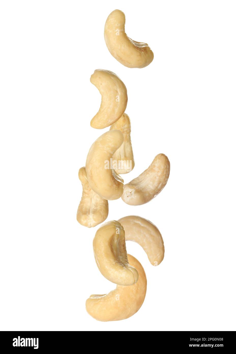 Tasty raw cashew nuts falling on white background Stock Photo - Alamy