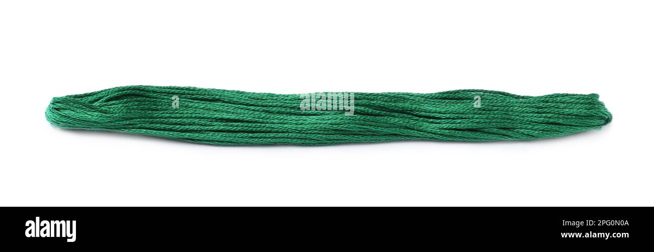 Bright green embroidery thread on white background Stock Photo - Alamy