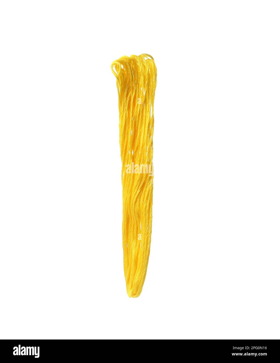 Bright yellow embroidery thread on white background Stock Photo - Alamy