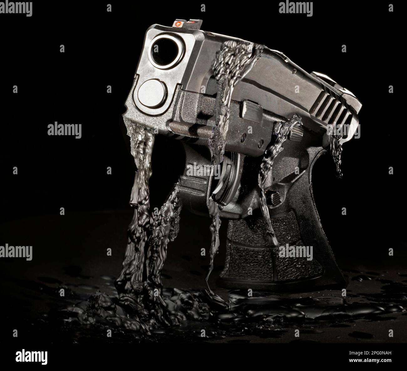Semi-auto handgun that is melting on a black background Stock Photo - Alamy