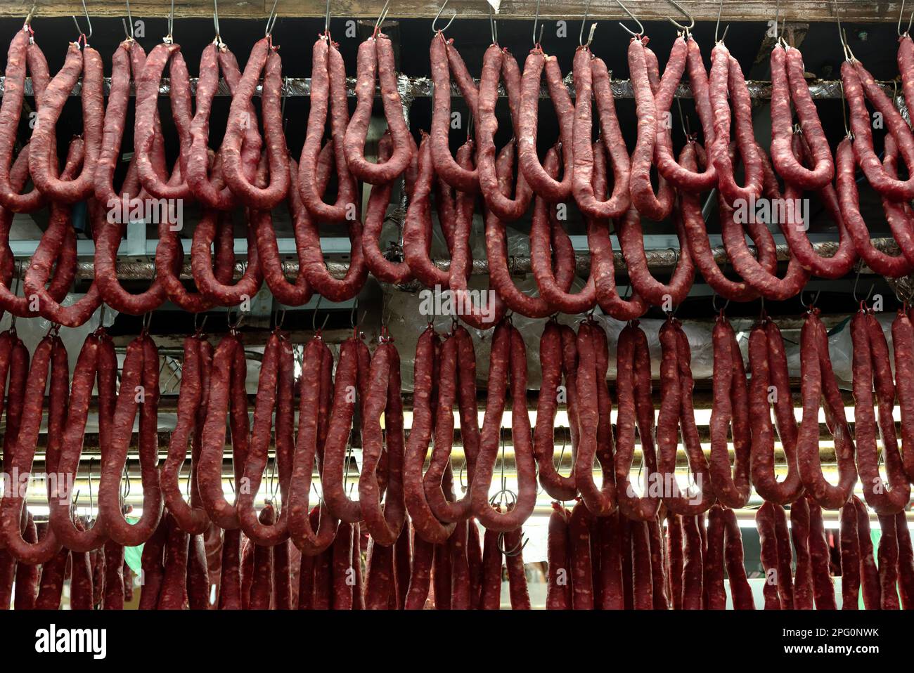 Chorizo sausages hanging on market stall Stock Photo - Alamy