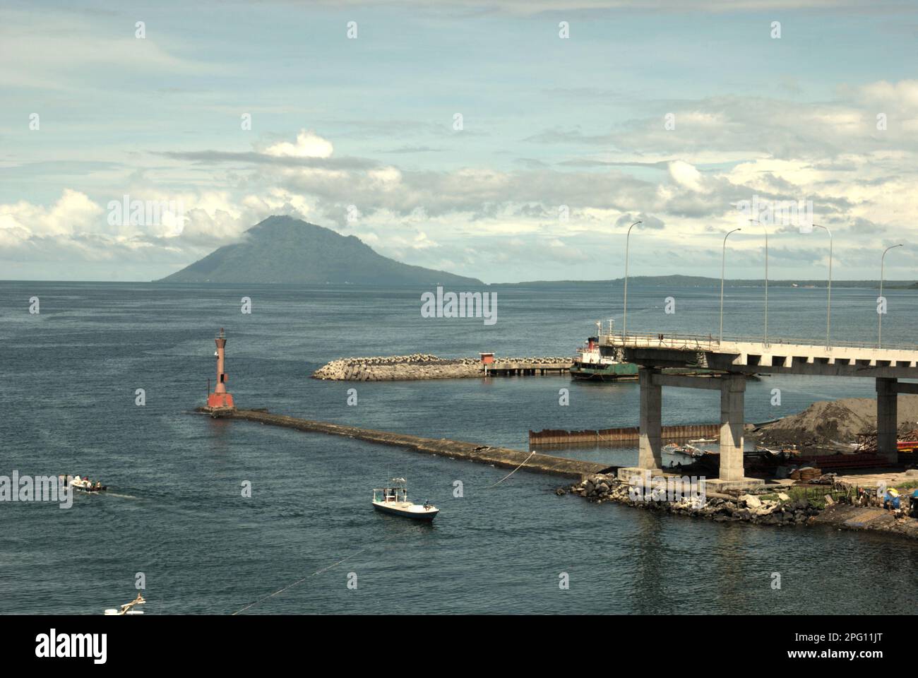 View of the Bay of Manado with Mount Manado Tua in a foreground of a ...