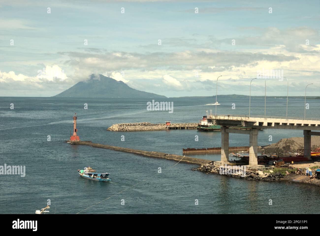 View of the Bay of Manado with Mount Manado Tua in a foreground of a ...