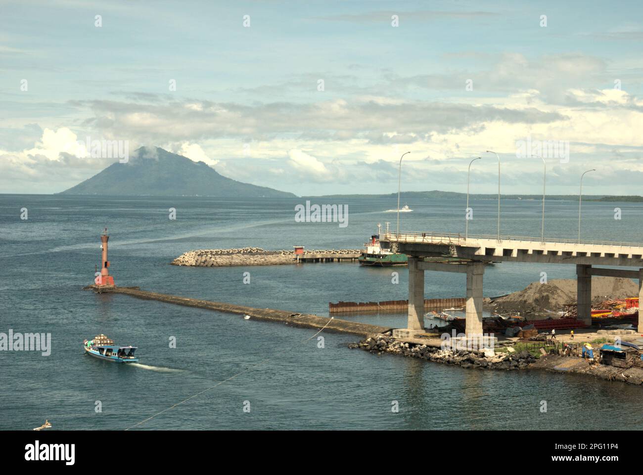 View of the Bay of Manado with Mount Manado Tua in a foreground of a ...