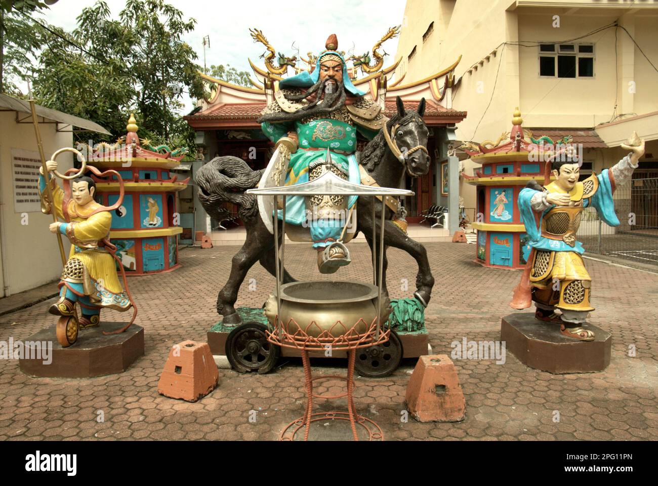 Sculptures of warriors and Kwan Kong (Guan Yu) god riding a horse, at ...