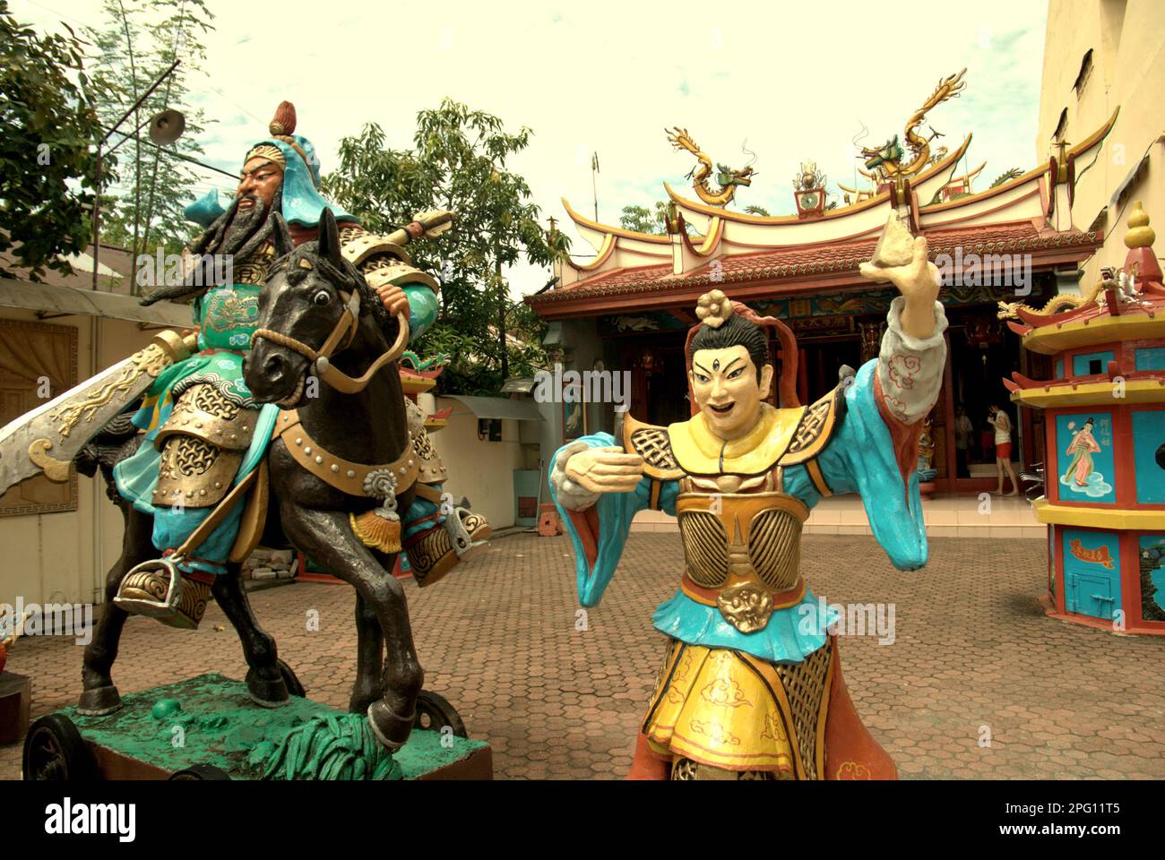 Sculptures of a warrior and Kwan Kong (Guan Yu) god riding a horse, at ...