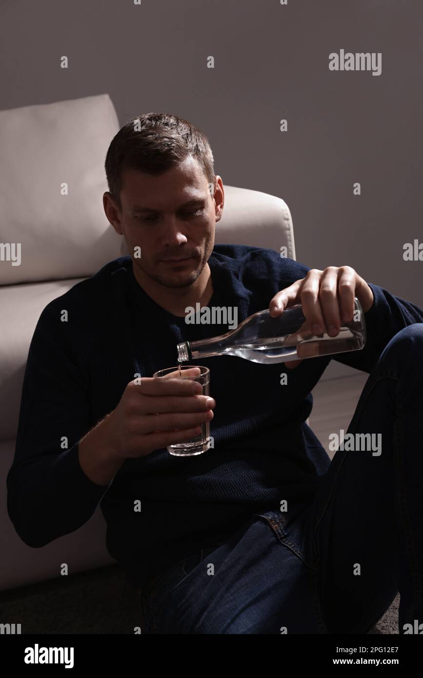 Alcoholic man sofa addiction hi-res stock photography and images - Alamy