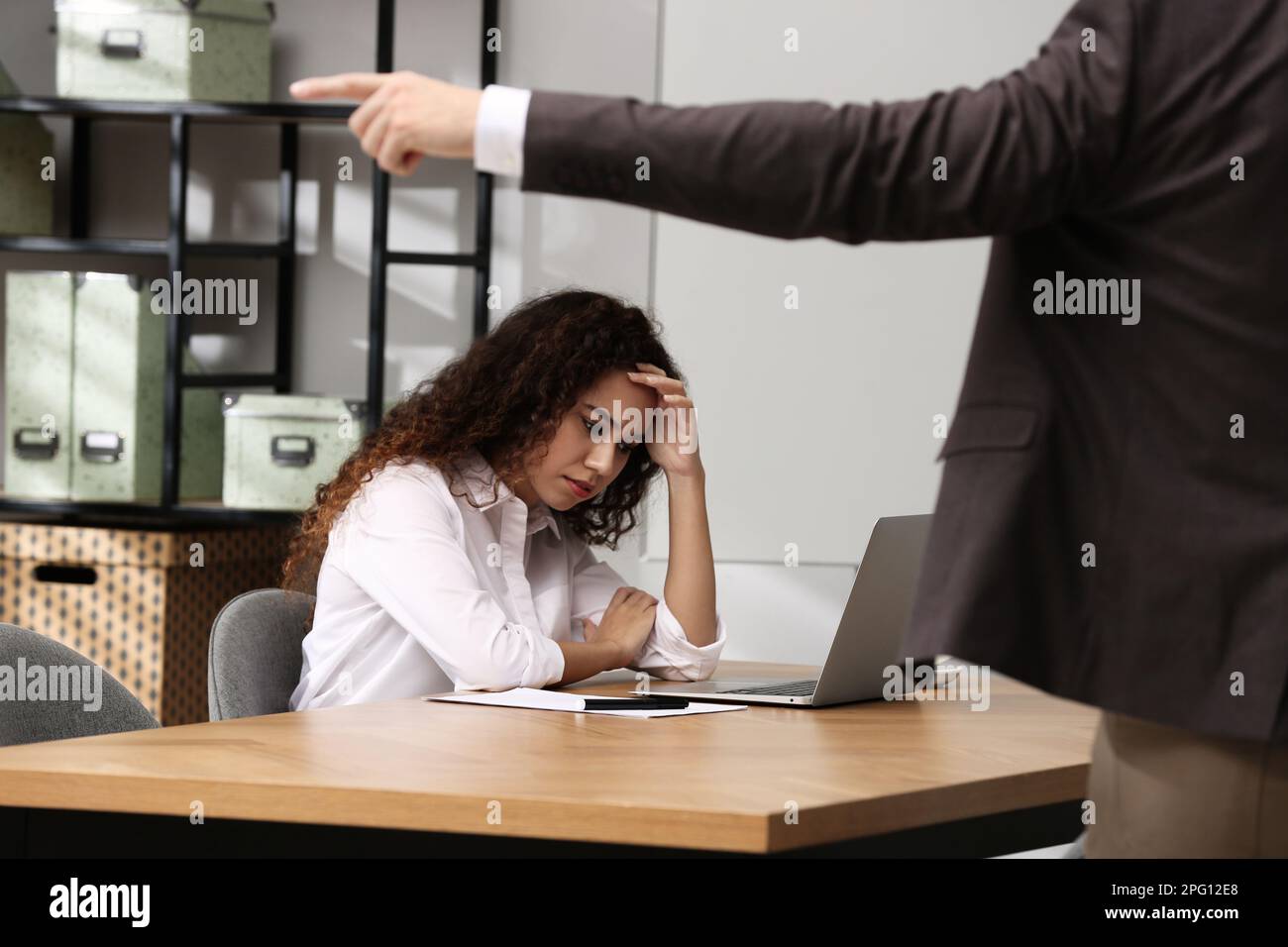 African American woman suffering from racial discrimination at work ...