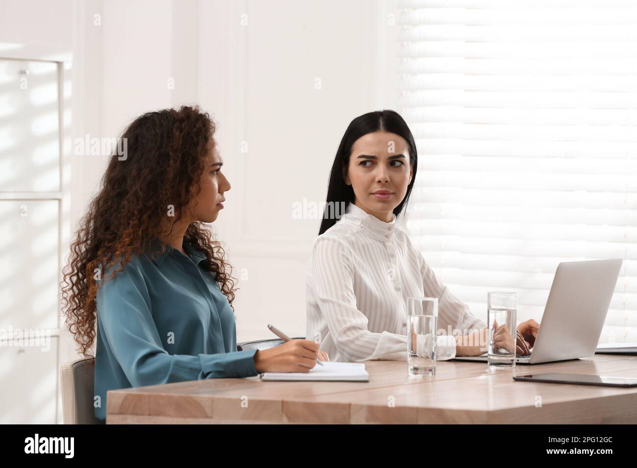 African American woman suffering from racial discrimination at work ...
