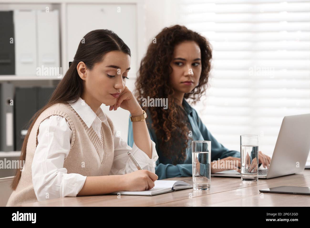 African American woman suffering from racial discrimination at work ...