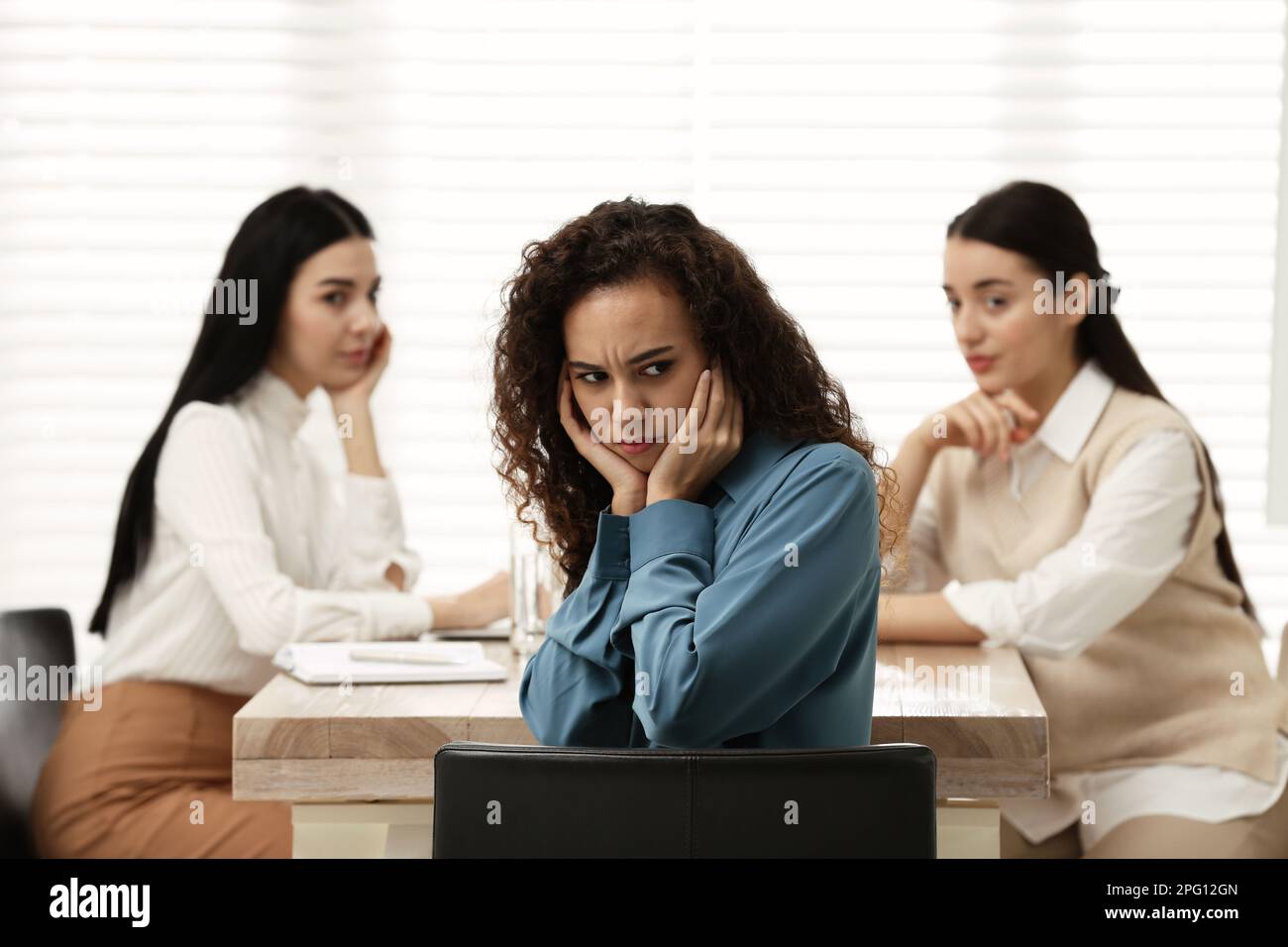 African American woman suffering from racial discrimination at work ...