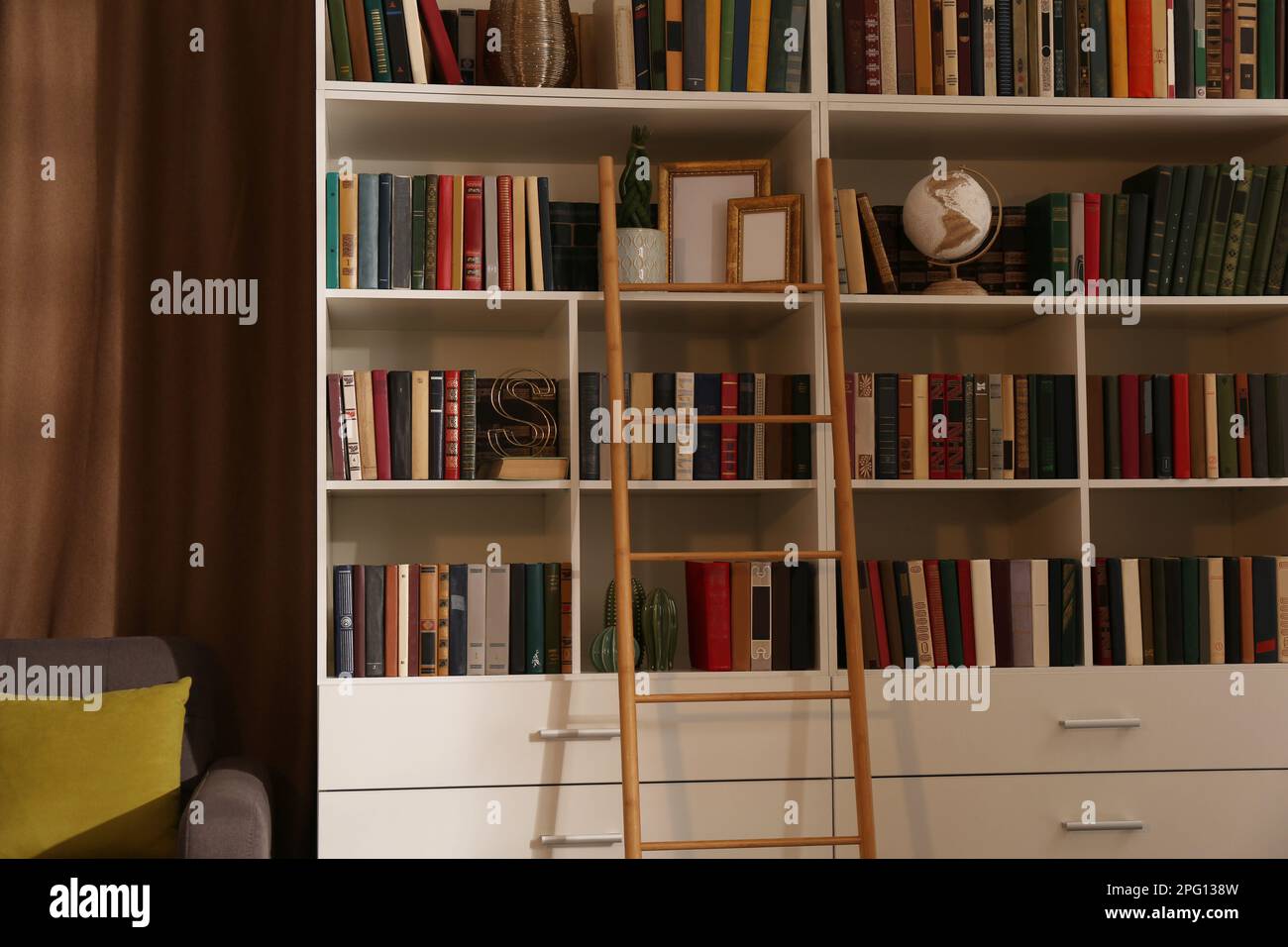Home library interior with collection of different books on shelves ...