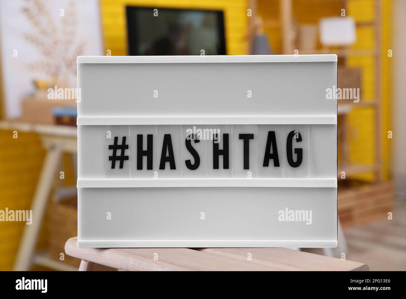 Light box with symbol and word Hashtag on wooden table indoors Stock ...