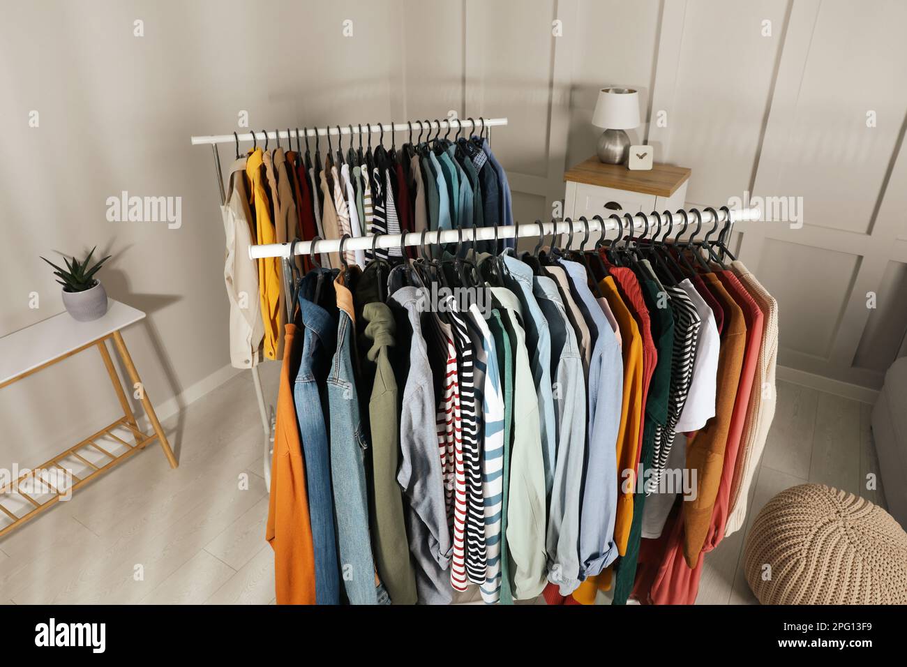 Racks with stylish clothes indoors, above view. Fast fashion Stock ...