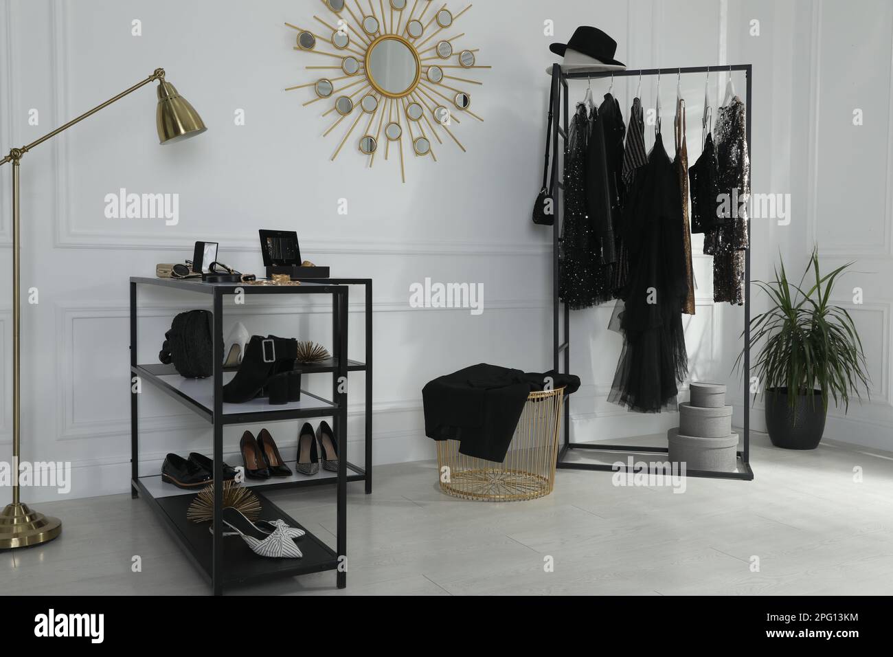 Stylish dressing room interior with trendy clothes, shoes and ...
