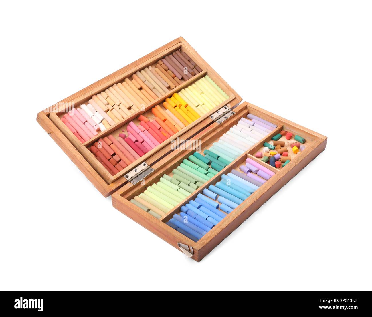 Set of soft pastels on white background in wooden box. Drawing material ...