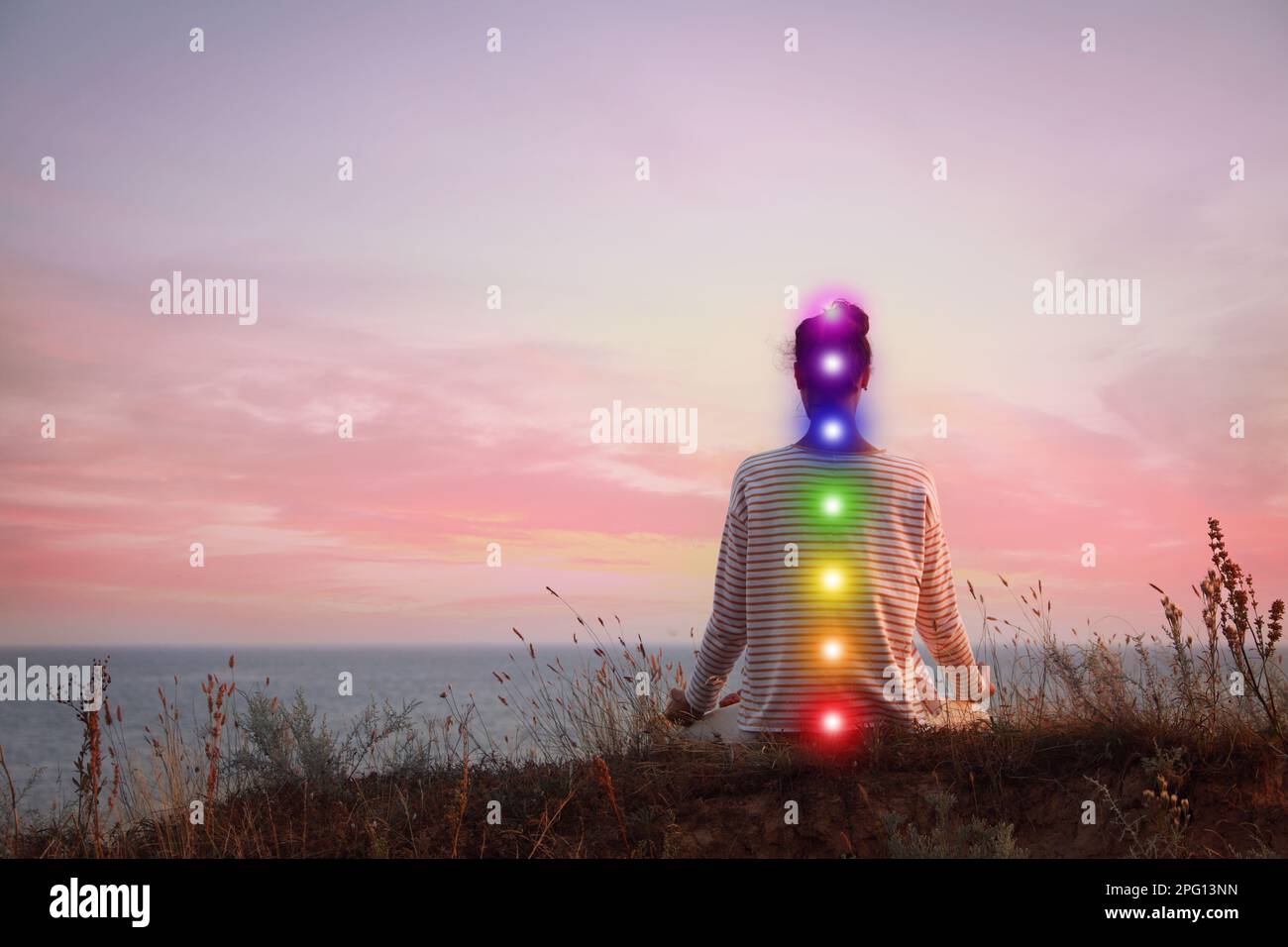 Woman meditating near sea, back view. Scheme of seven chakras ...