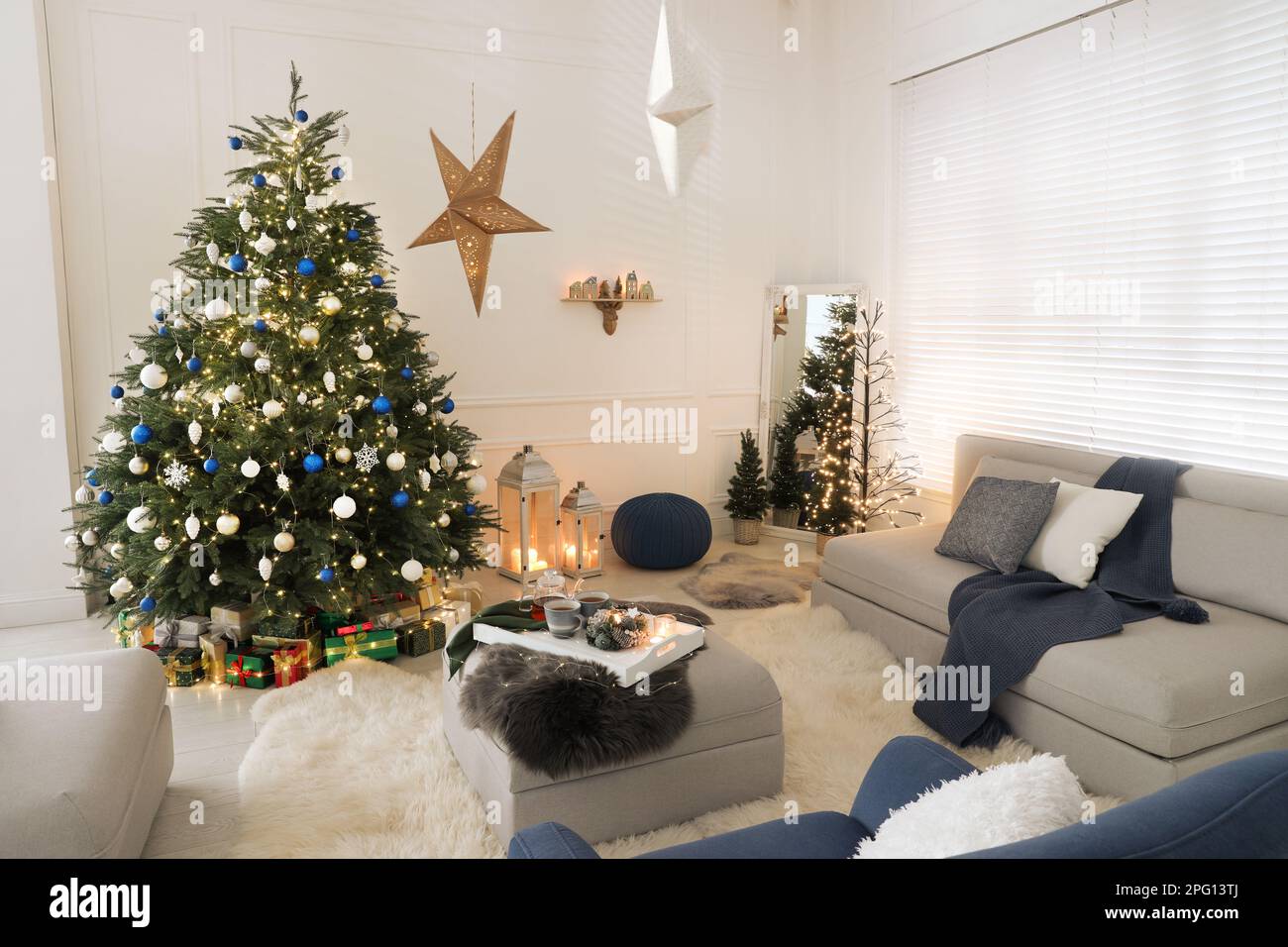 Cozy living room interior with beautiful Christmas tree and comfortable ...