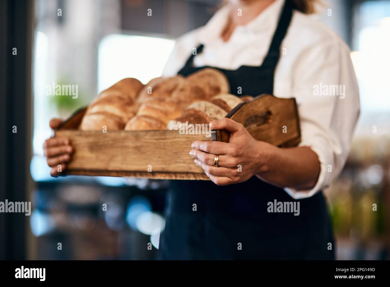 Did you remember to pick up some bread. a woman holding a selection of ...