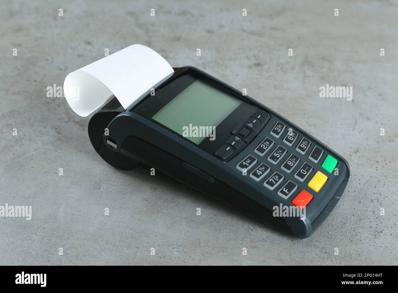 New modern payment terminal on grey table Stock Photo - Alamy