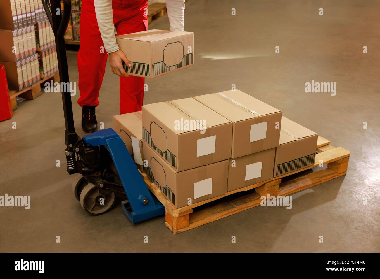 Worker sorting cardboard boxes in warehouse, closeup. Logistics concept ...