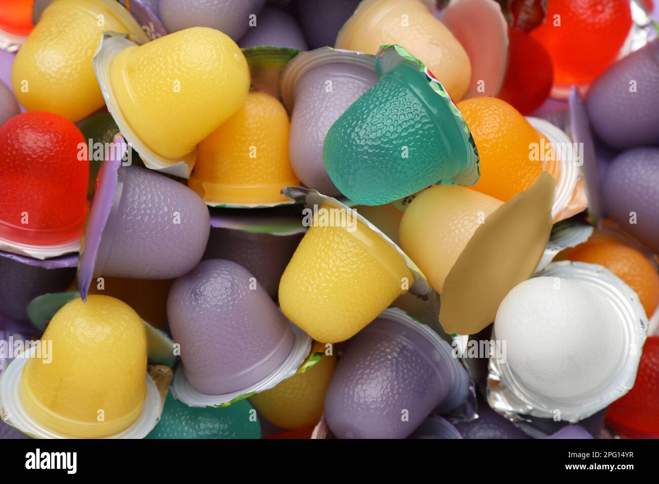 Tasty bright jelly cups as background, top view Stock Photo - Alamy