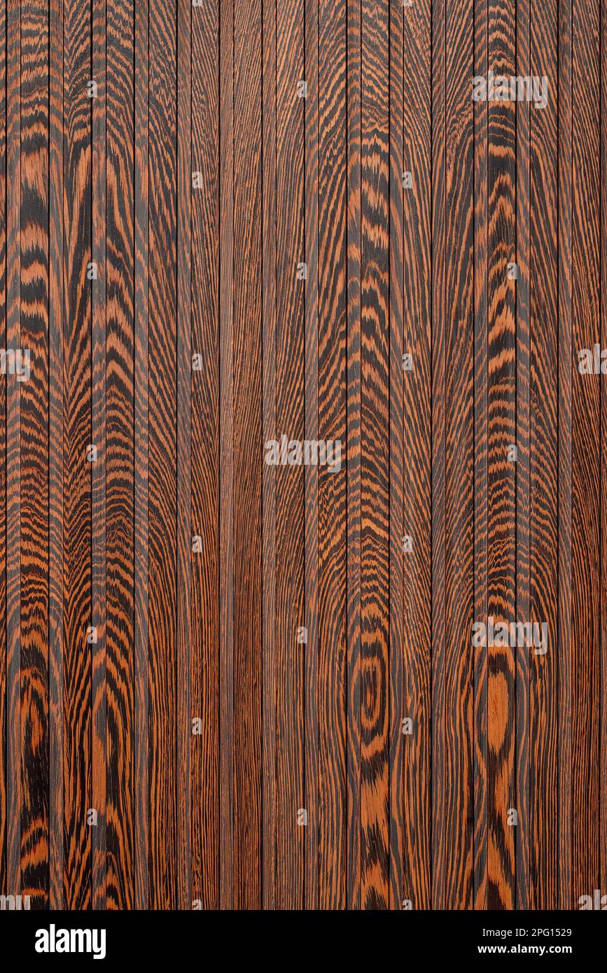 The natural wood texture of rich chocolate color on decorative vertical ...