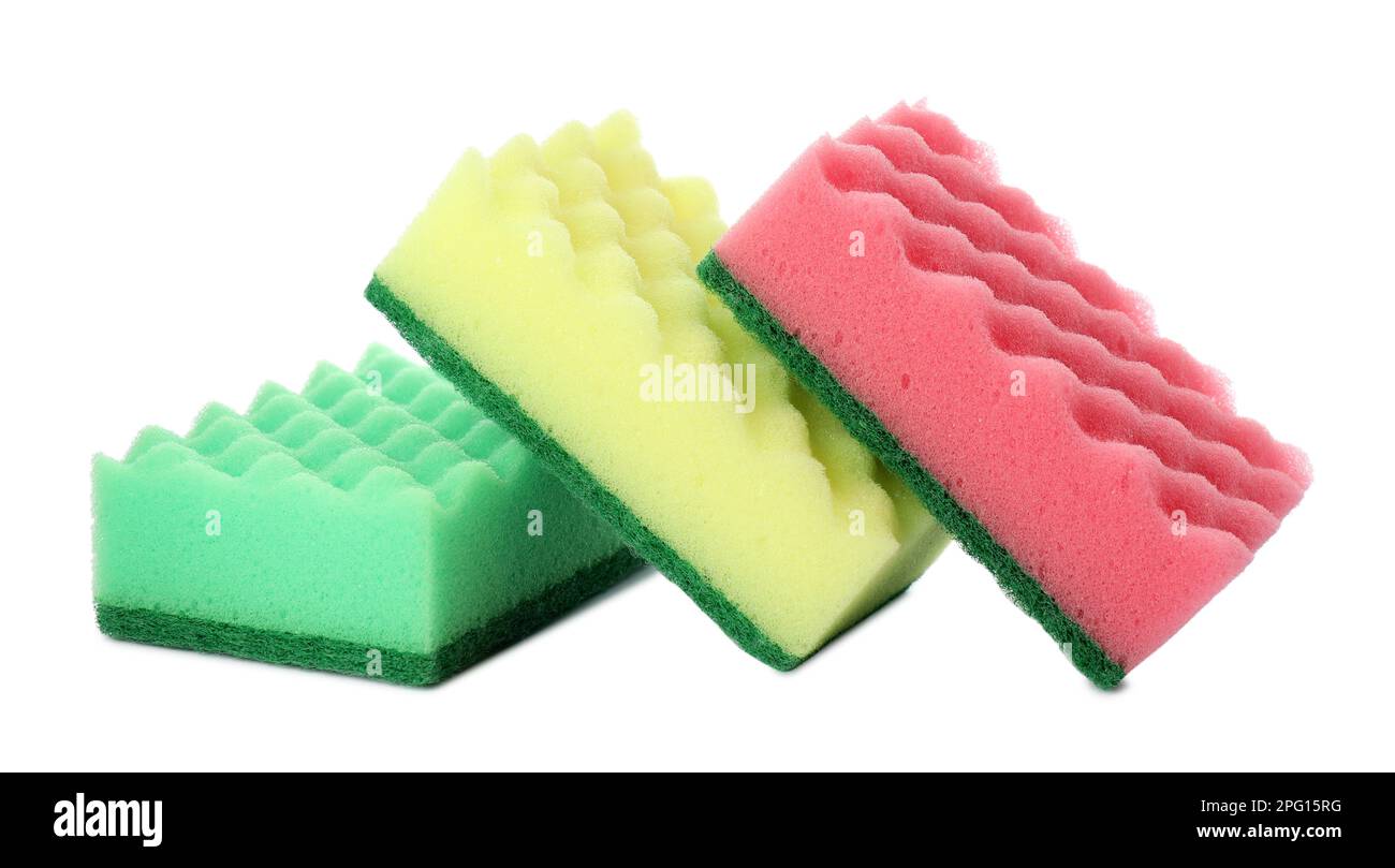 Bright cleaning sponges with abrasive scourers on white background ...