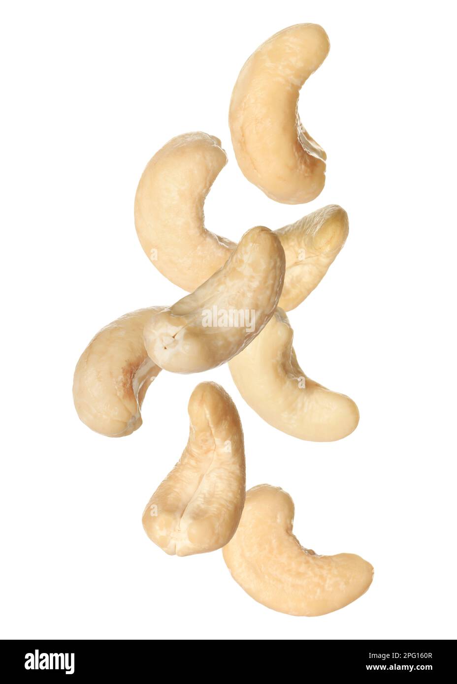 Tasty raw cashew nuts falling on white background Stock Photo - Alamy