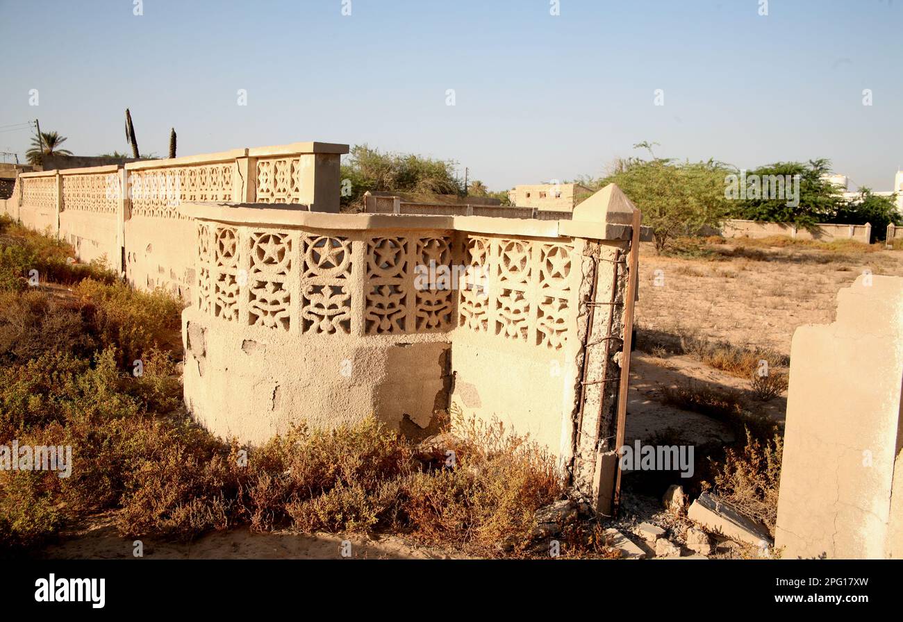 Broken wall around the courtyard of an old mosque in al Jazirat al ...