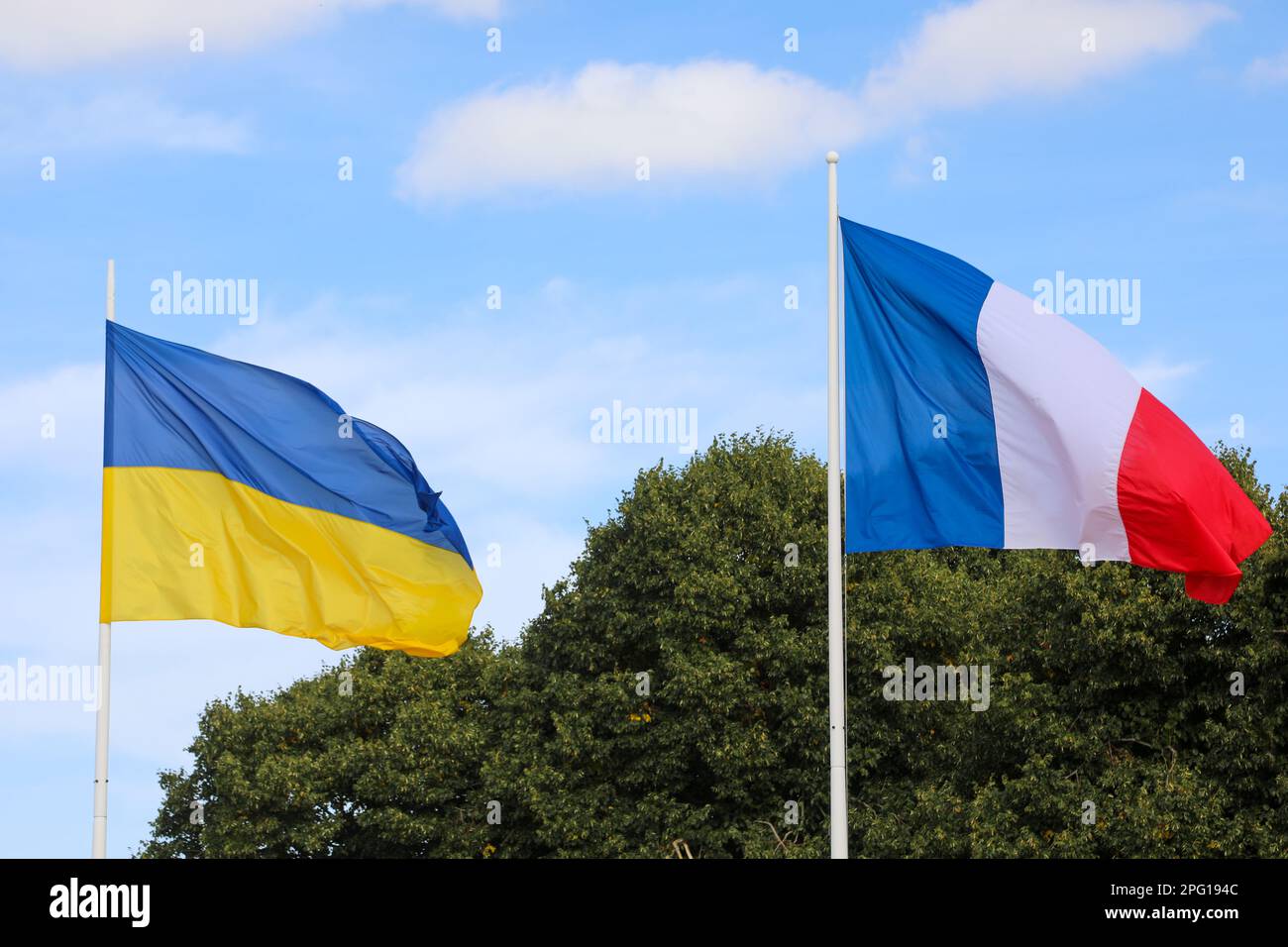 Two flags one of the yellow and blue Ukraine and one of tricolor France ...