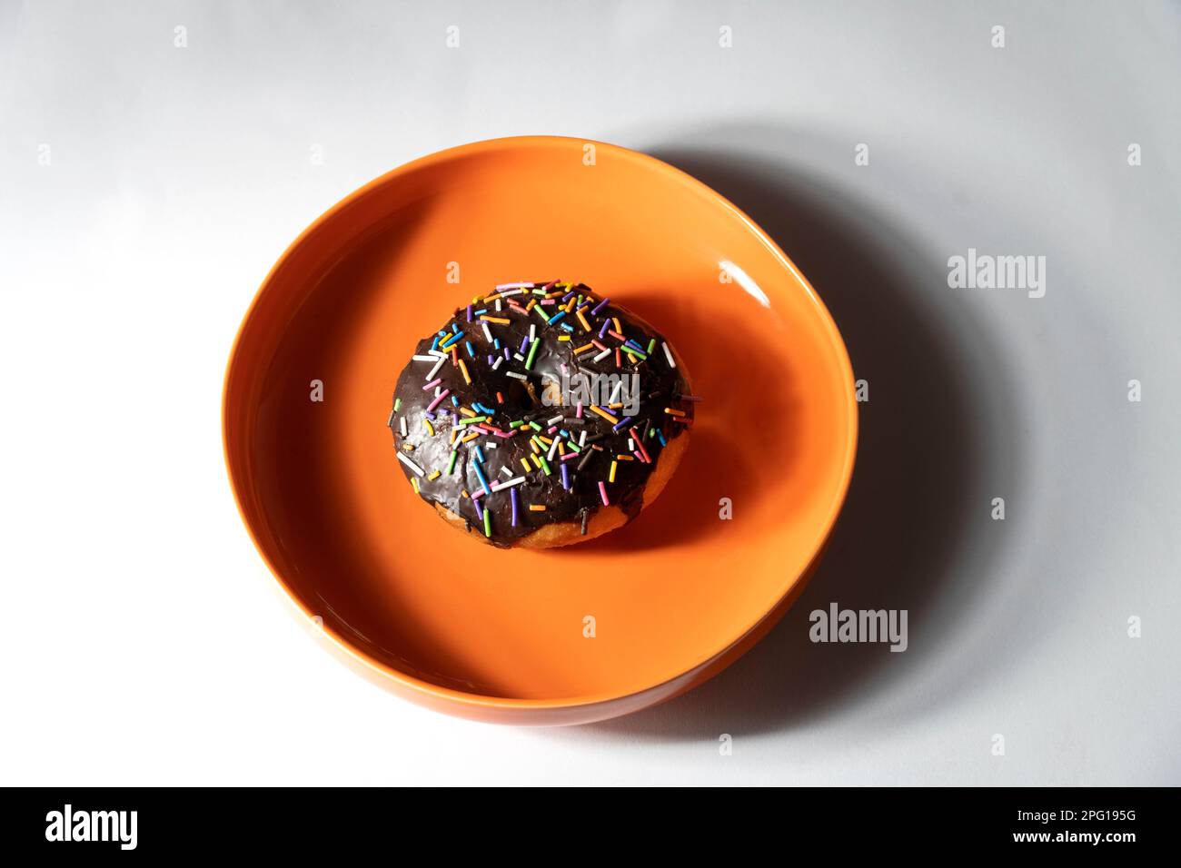 Orange plate on white background hi-res stock photography and images ...