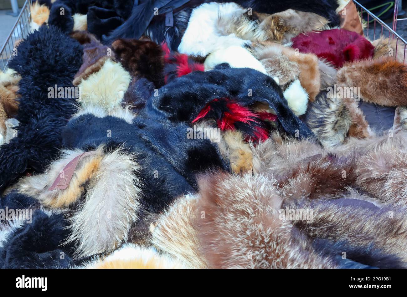background of scraps of animal fur stoles for sale in the luxury ...