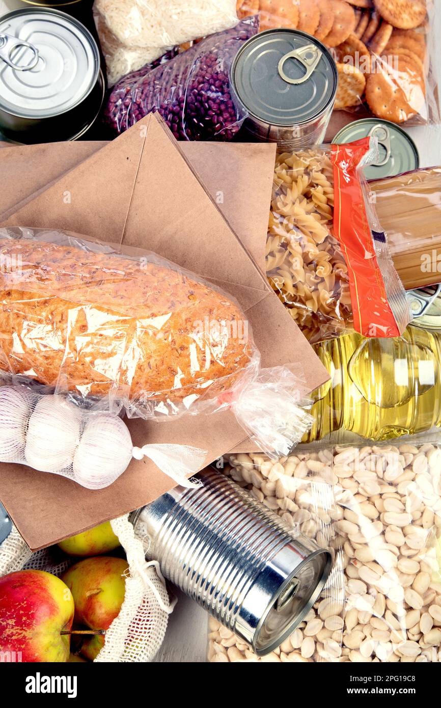 Food donations with pasta, rice, oil, peanut butter, canned food, jam ...