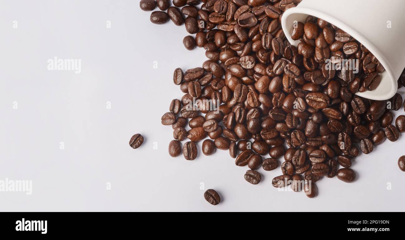 Fancy a cuppa. Studio shot of a tipped over paper cup filled with ...