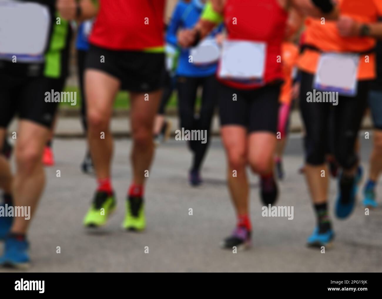 Intentionally blurred group of runners during the ideal running race as ...