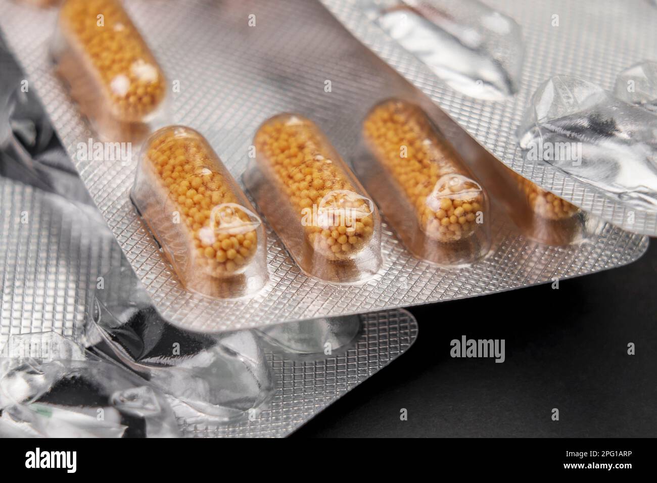 Brown pharmaceutical capsules particles in hi-res stock photography and ...