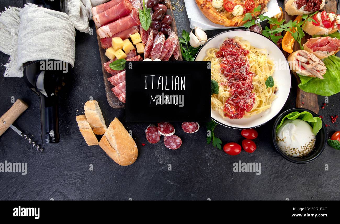 Italian food dishes on dark background. Traditional italian cuisine ...