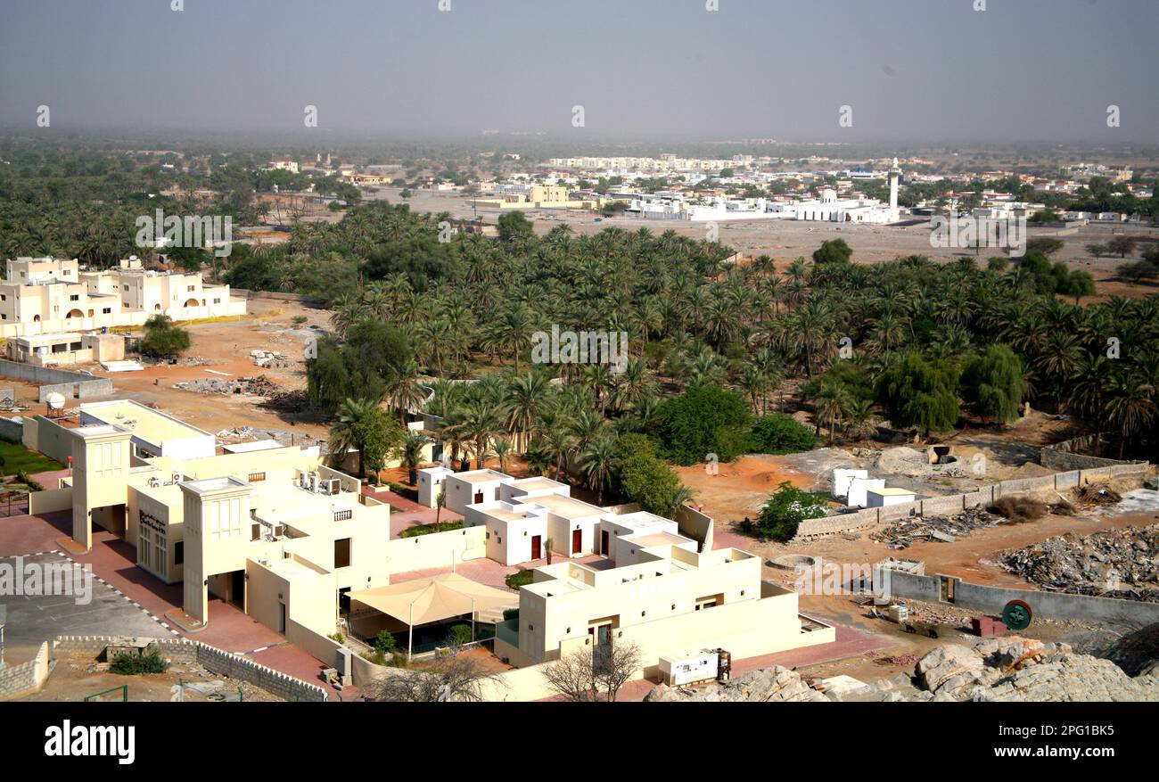 Khatt Hot Springs Resort foreground with the town of Ras al-Khaimah in ...