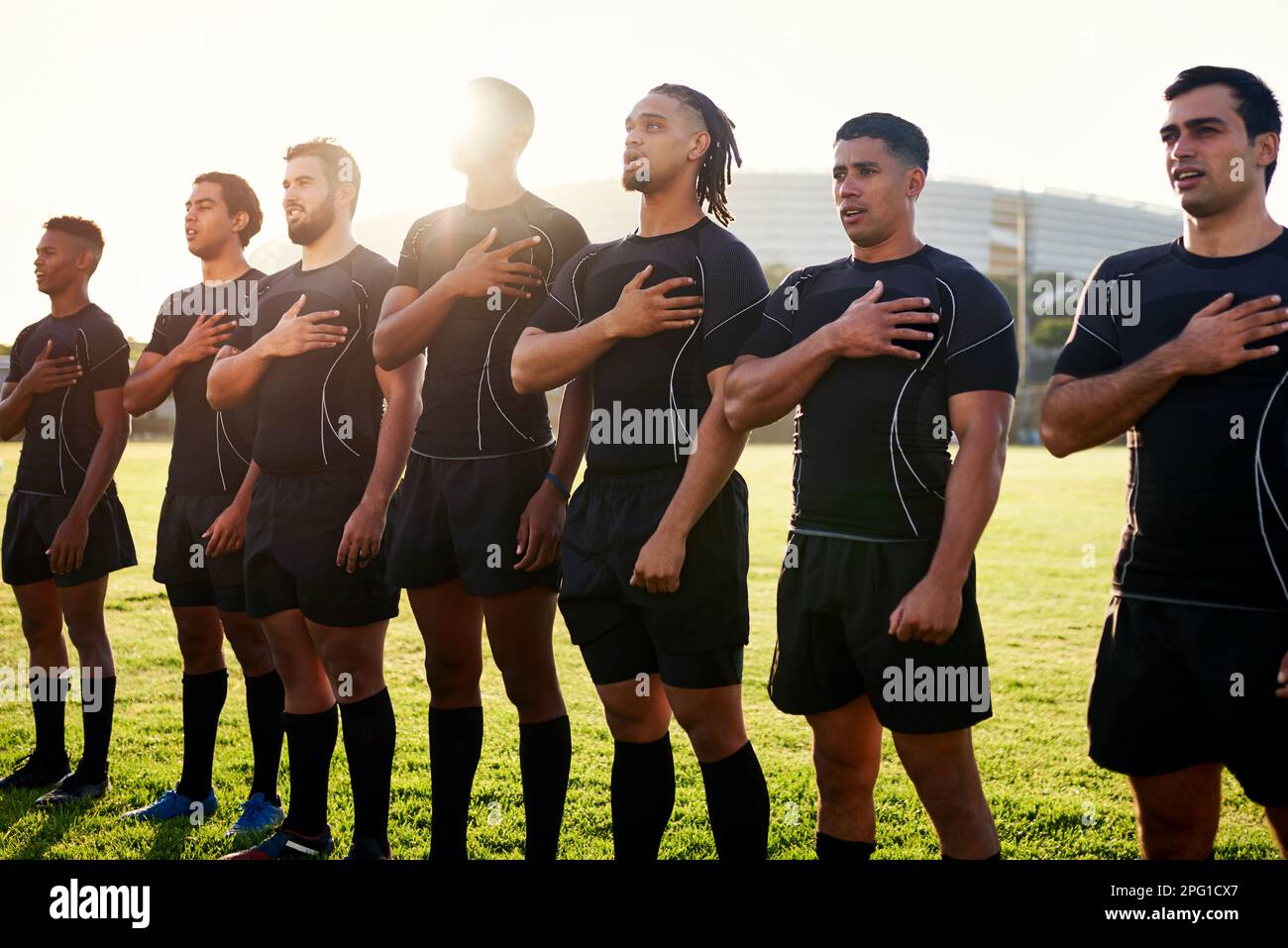 Keeping national pride. a diverse group of sportsmen standing together ...